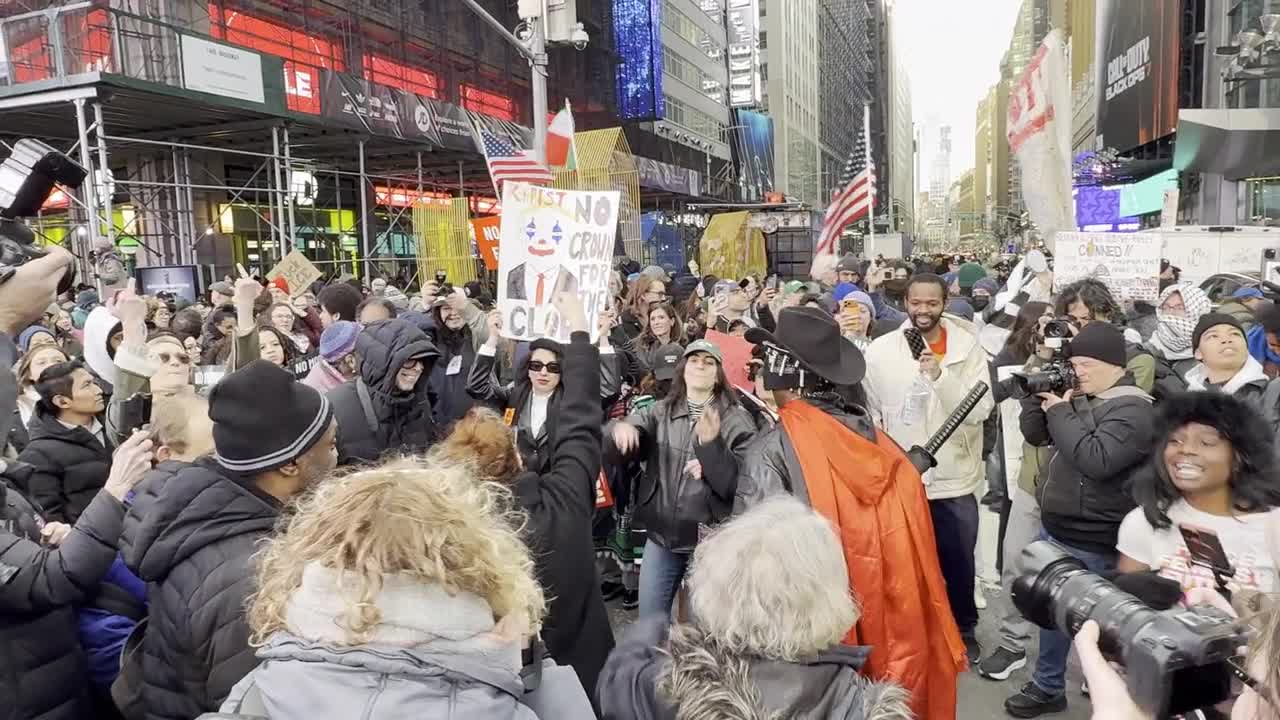 New York City: Anti-Trump demonstrators dance near Times Square with ...