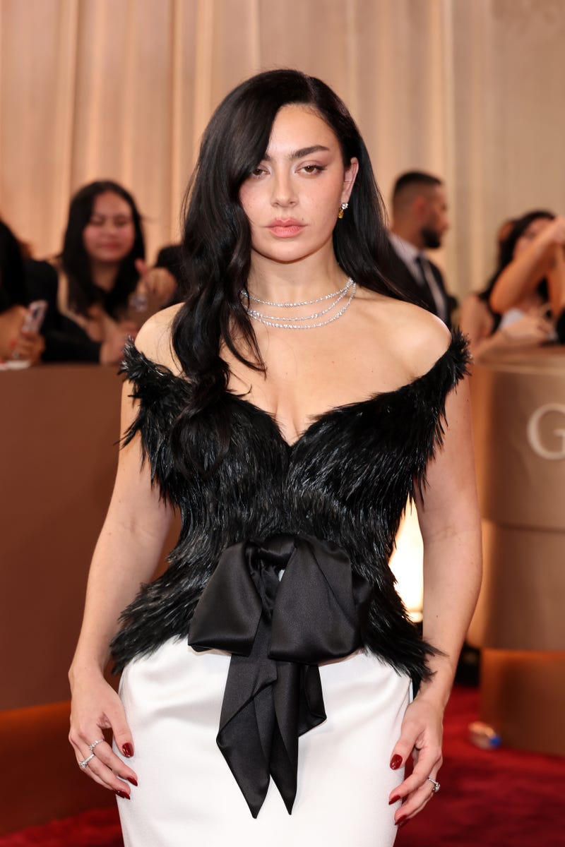 Charli XCX dresses up in Saint Laurent feathers to present at the 2026 ...