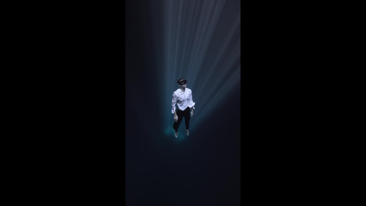 Freediving with sunbeams in a cenote in Tulum, Mexico