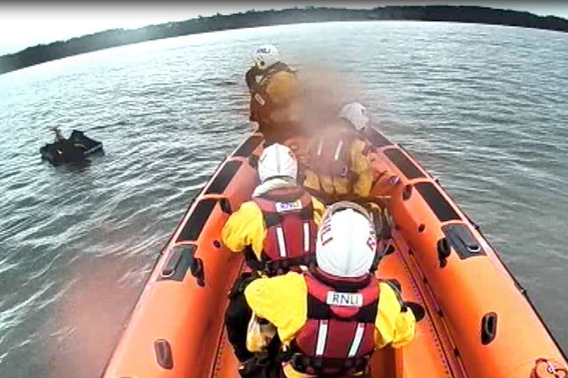 Hero Edinburgh RNLI lifeboat crew rescue person from inflatable ...