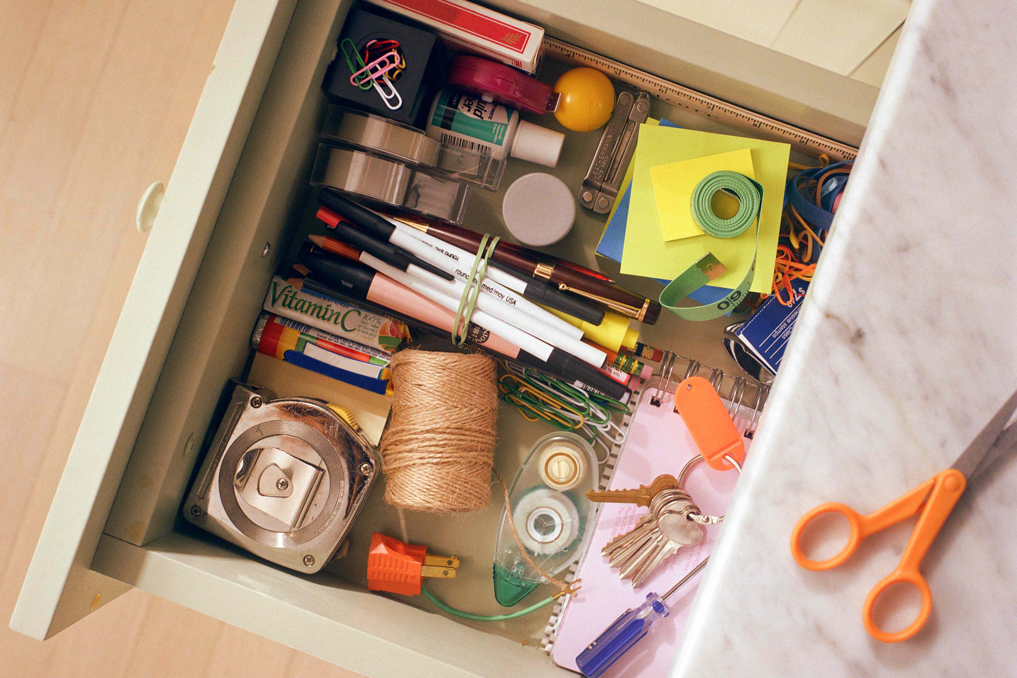 We asked pro organizers what they do (and don't) keep in a junk drawer ...