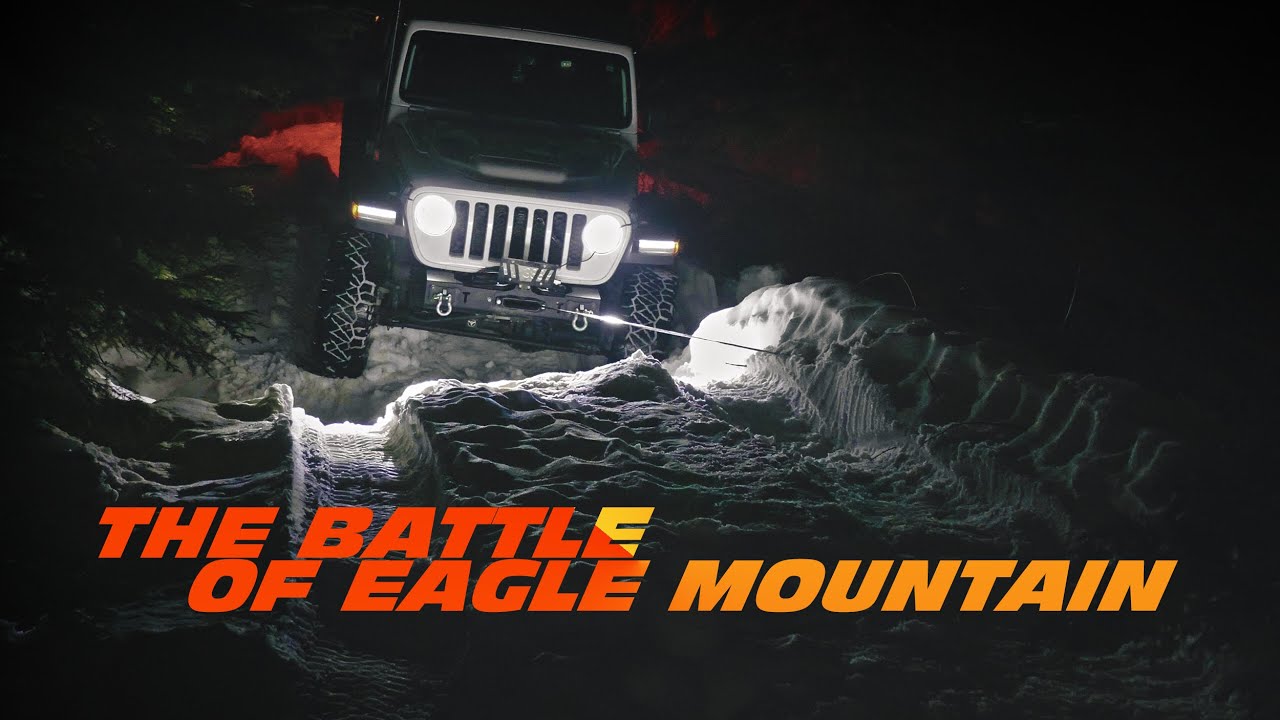 Jeep Gladiator off-roading in snow and rocks