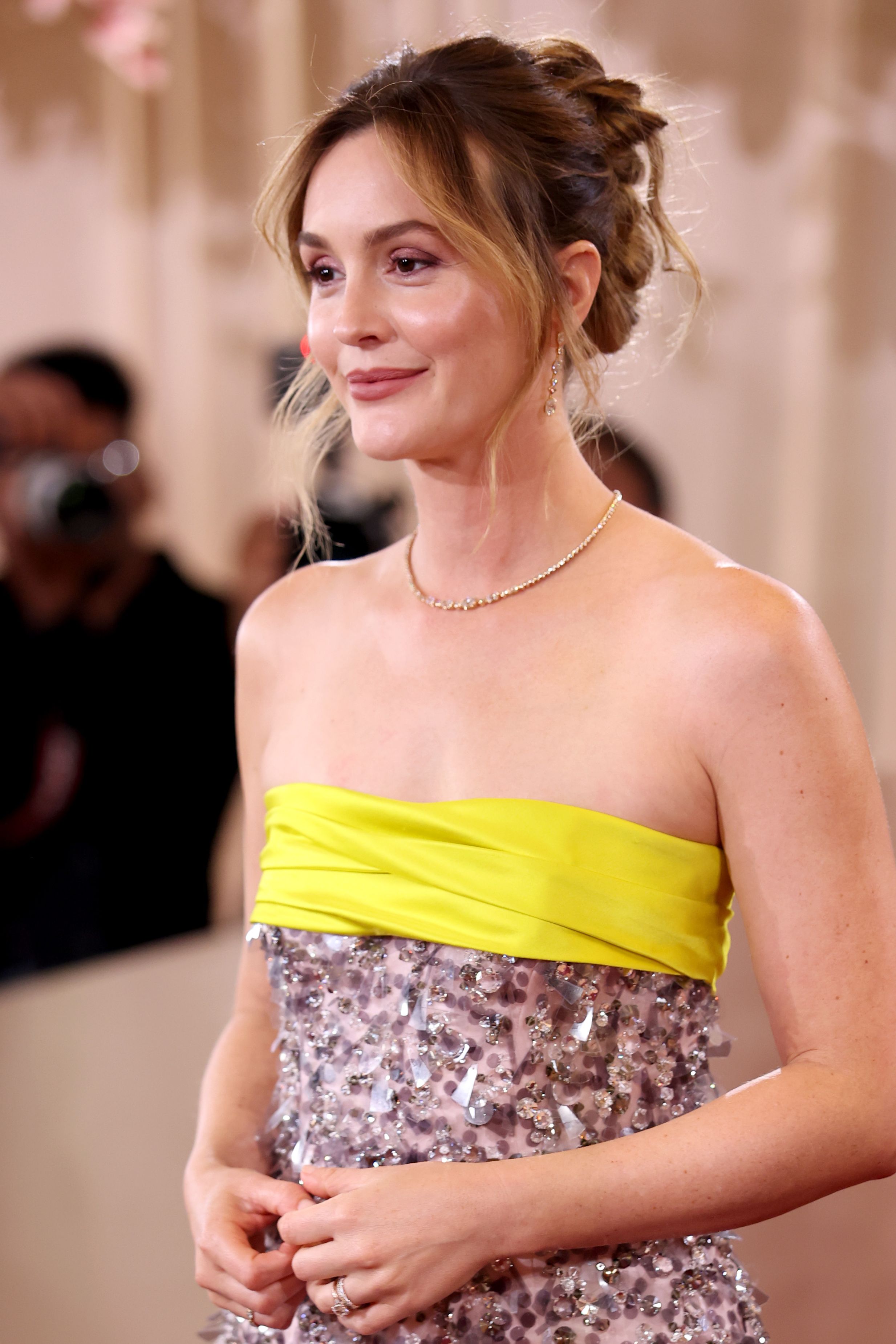 Say goodbye to the chignon—updos are getting looser and messier