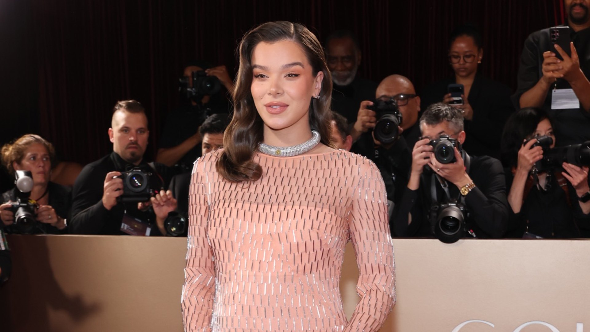 Pregnant Hailee Steinfeld cradles baby bump on Golden Globes red carpet