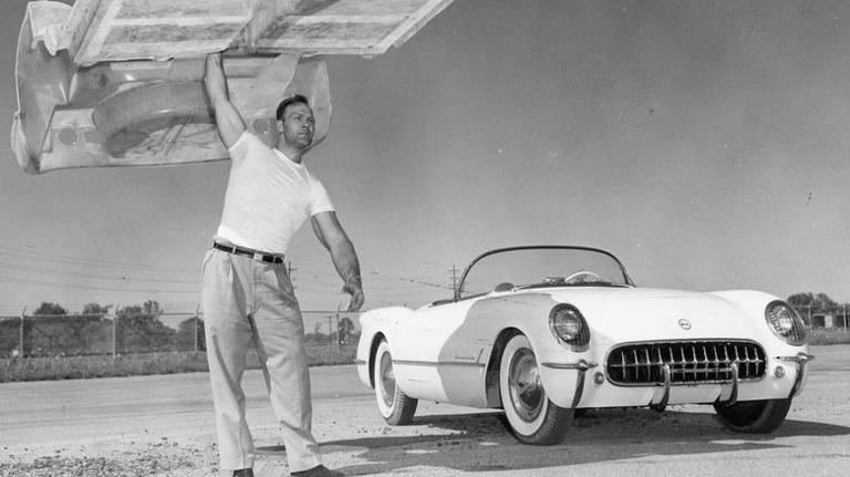 Why did Corvettes switch from fiberglass to SMC body materials?