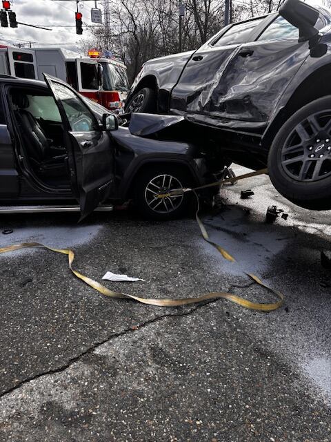 Crash leaves truck on top of car at Essex intersection
