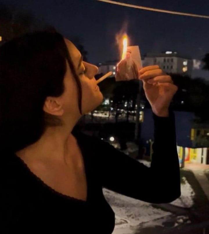 Iranian women burn Khamenei photo, defy hijab rules in protest