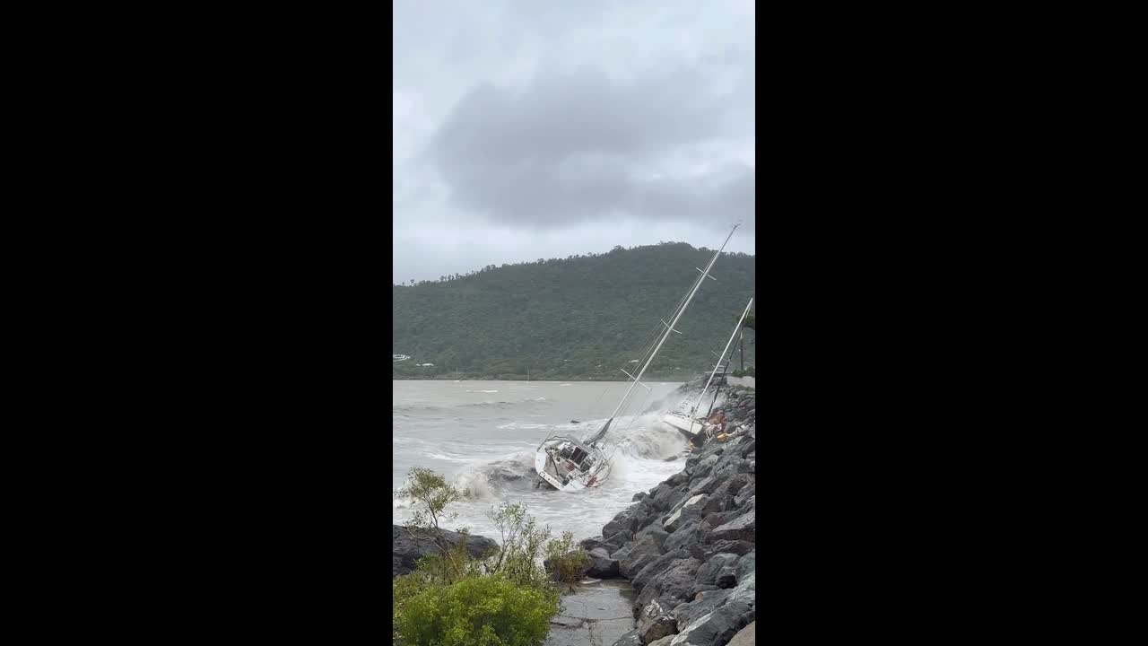Waves slam boat into port as cyclone hits Australia