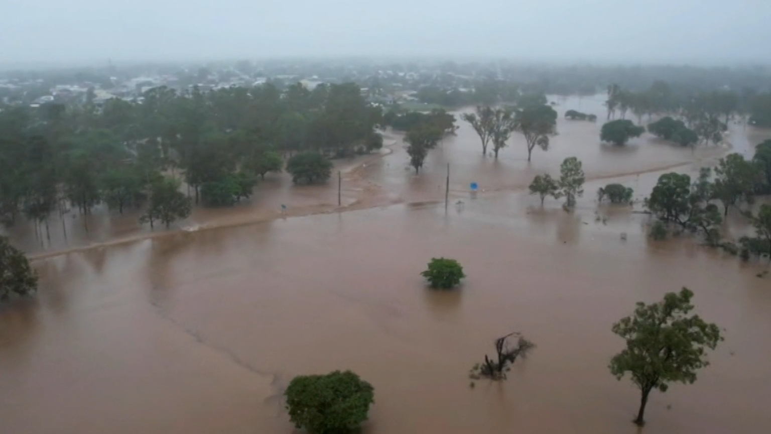 Queensland town records wettest day in 110 years as ex-cyclone lashes state