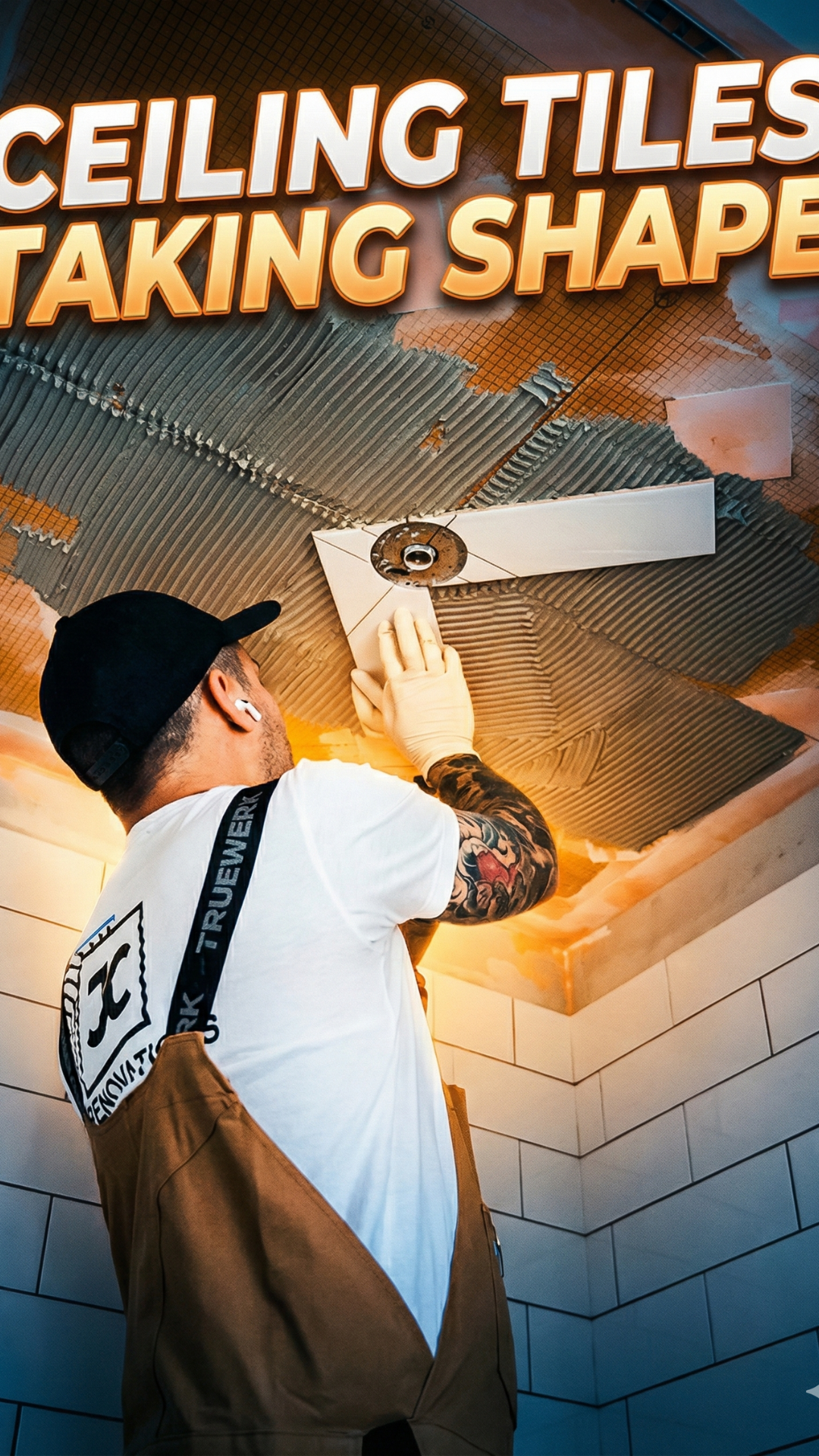 Installing ceiling tiles in progress