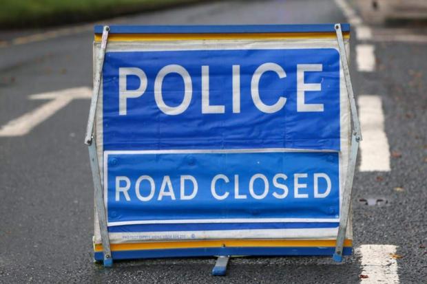 Road closed after car overturns and causes fuel spill during one ...