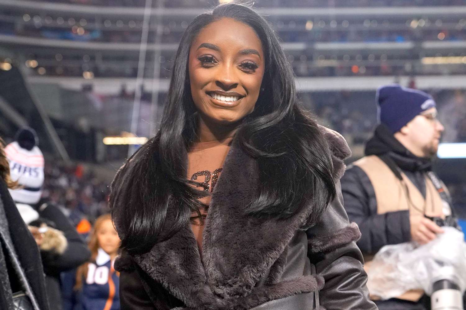 Simone Biles reveals her 'good luck' charm at Bears playoff game as ...