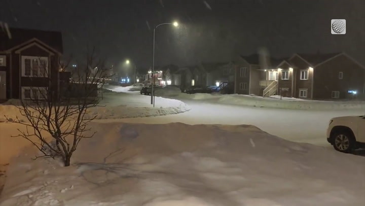 Snow falls at night in this Paradise, Newfoundland & Labrador neighbourhood
