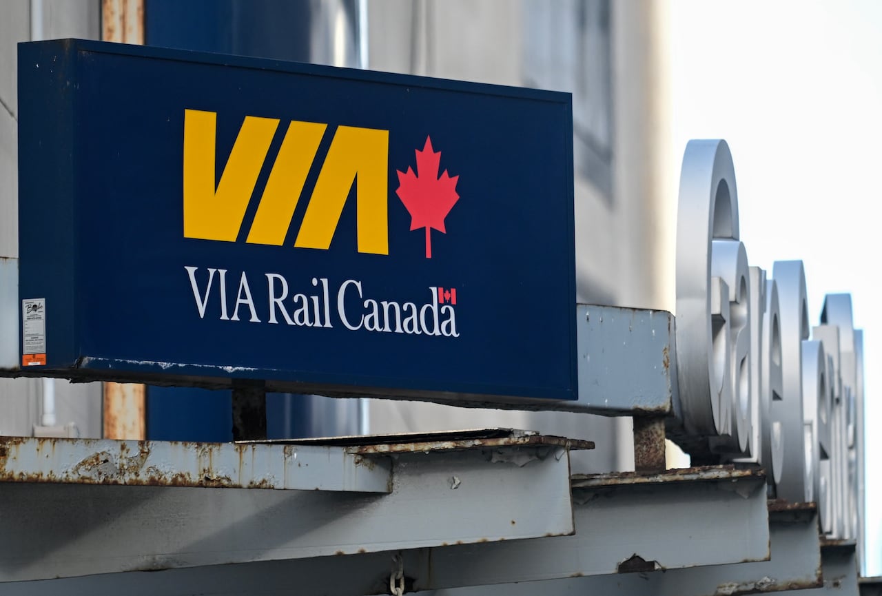 Passenger train crashes into 2 semi-trailer trucks in Lower St ...