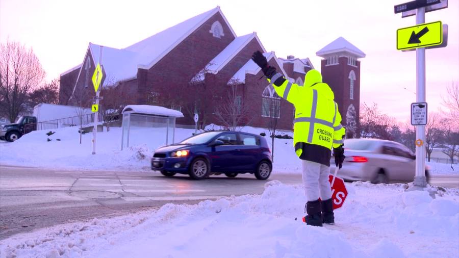 Grand Rapids crossing guard brightens commutes with waves, smiles