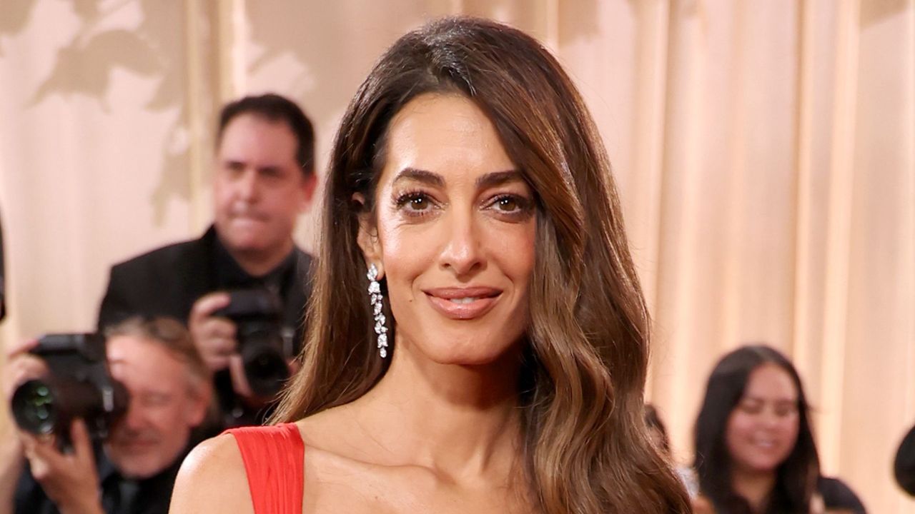 Amal Clooney delivered modern elegance in an on-trend, custom red dress ...