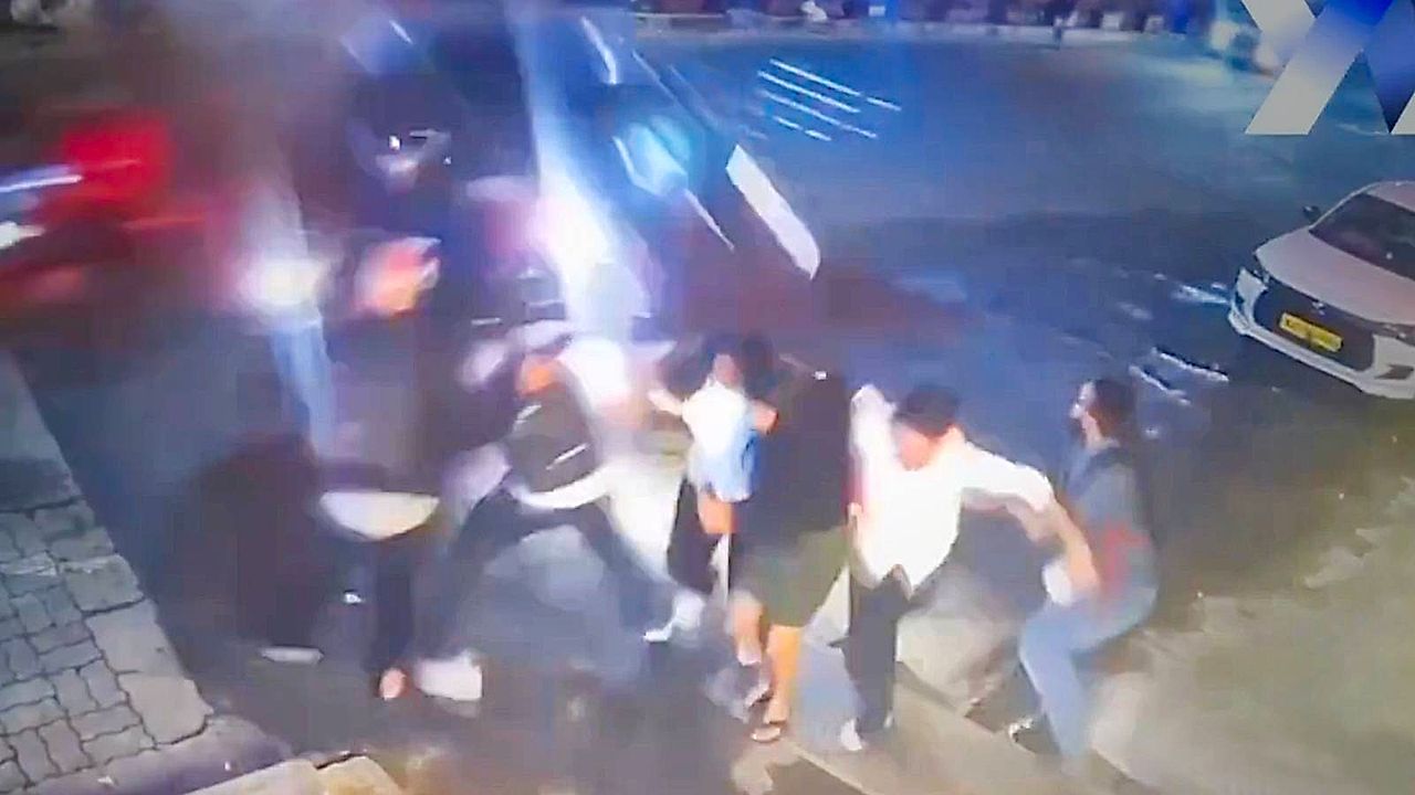 Pedestrians leap for safety as car jumps divider and crashes into ...