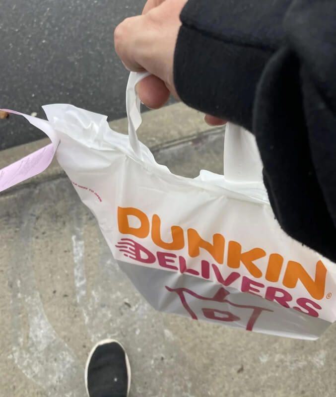Delivery driver sparks outrage with photo of customer's Dunkin' order ...