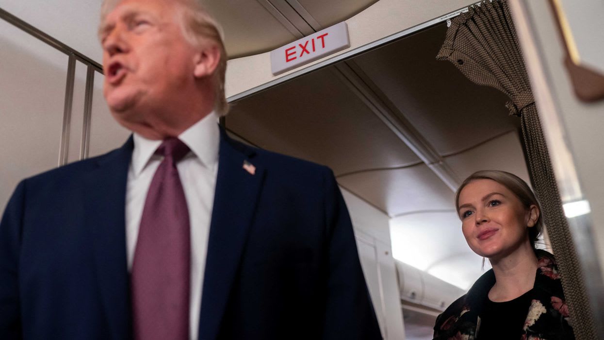Trump jokes about 'grabbing' press aide during Air Force One turbulence