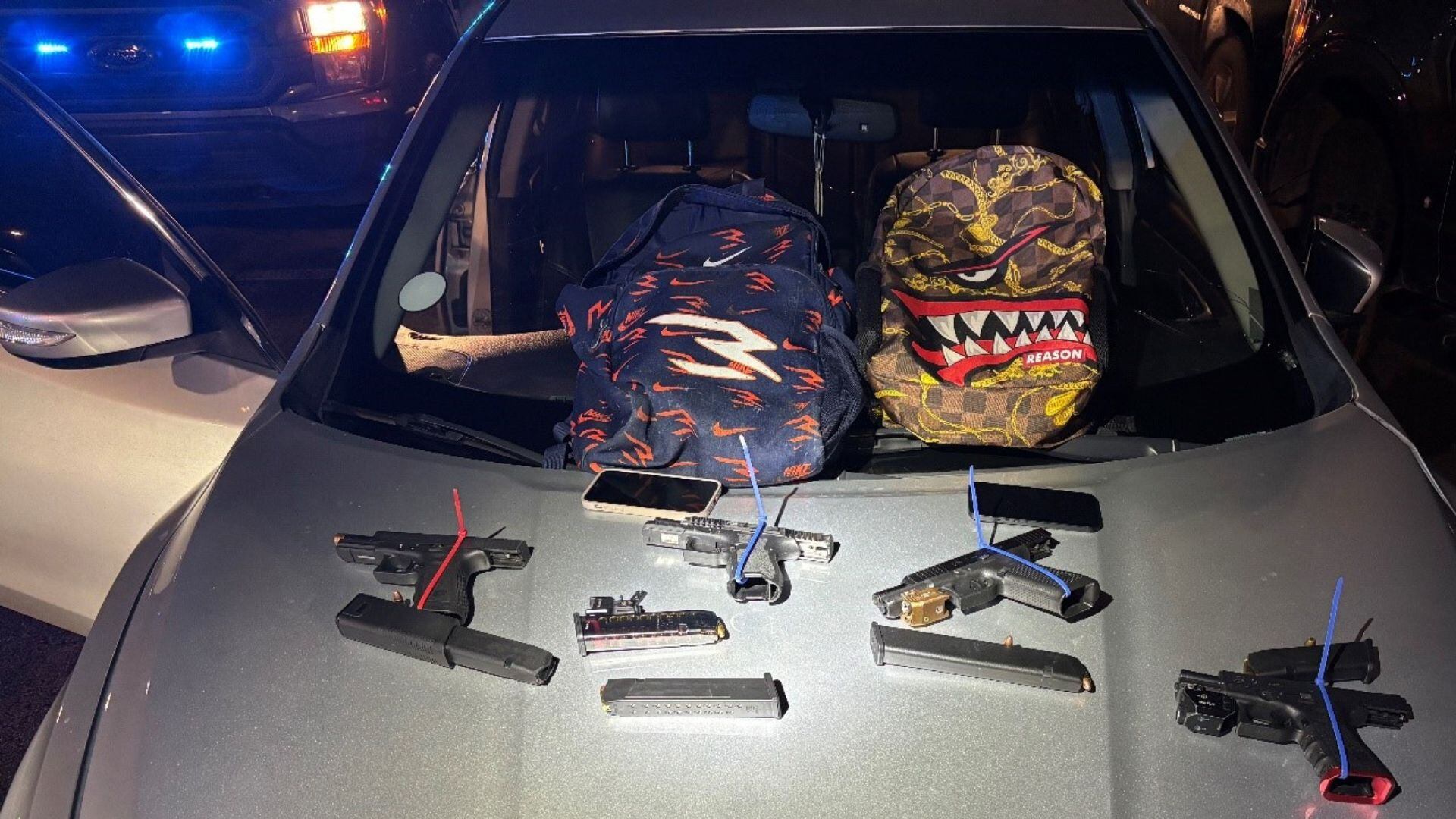 Group of young men arrested, guns recovered after stolen vehicle found ...