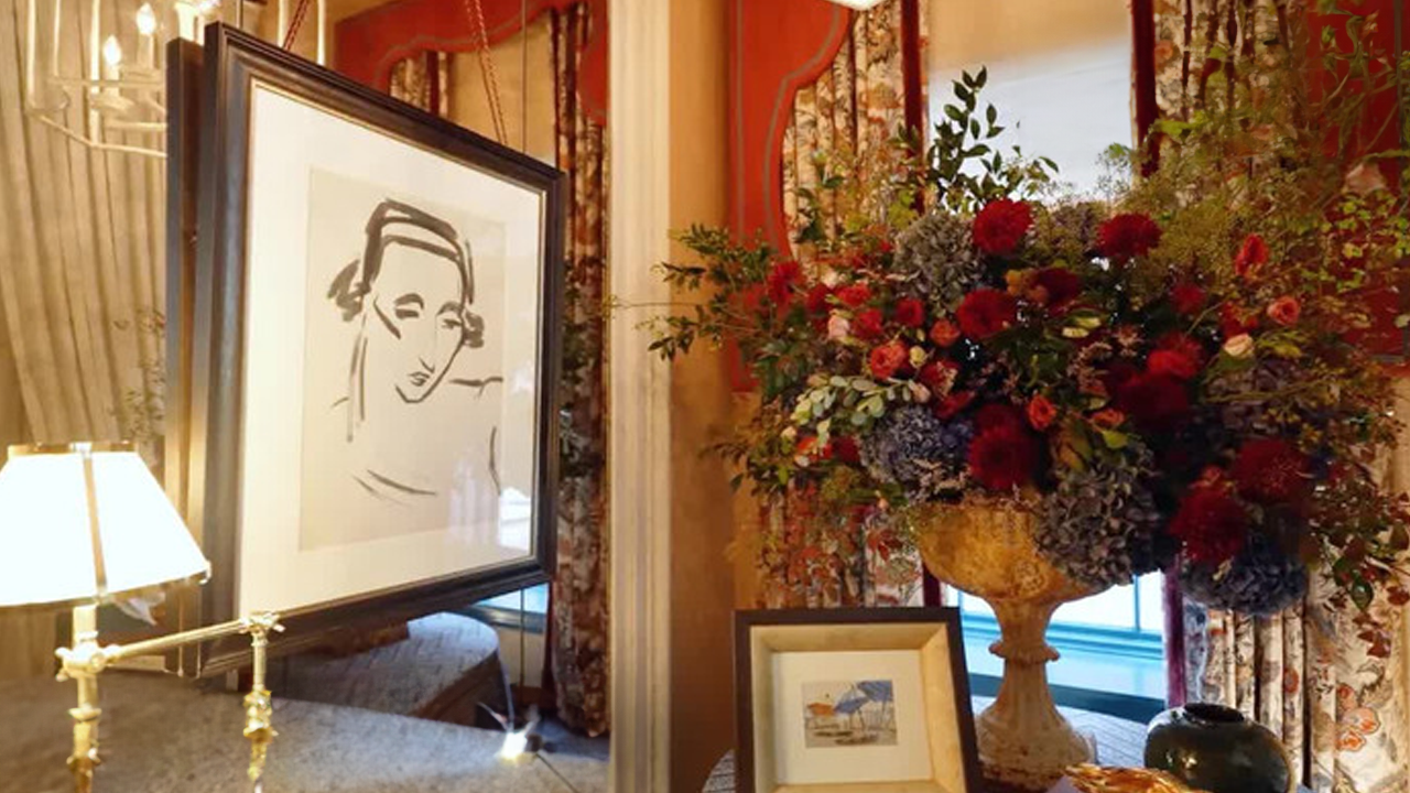 A hand-painted Mediterranean stair hall with lush florals