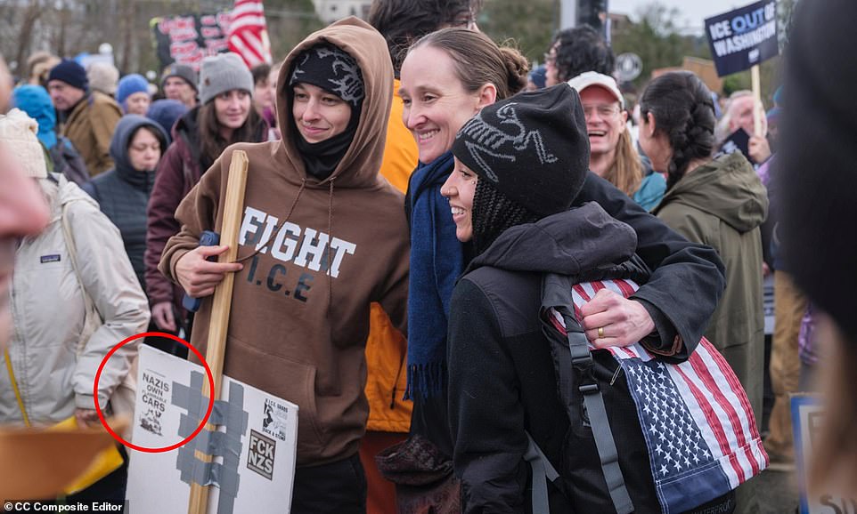 Seattle mayor poses for photo with activist holding placard calling for ...