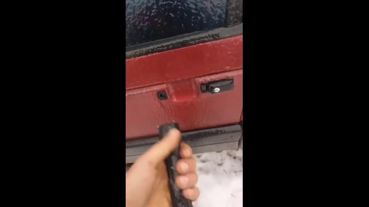 Frozen car door handle snaps in extreme cold in Pyatigory, Russia