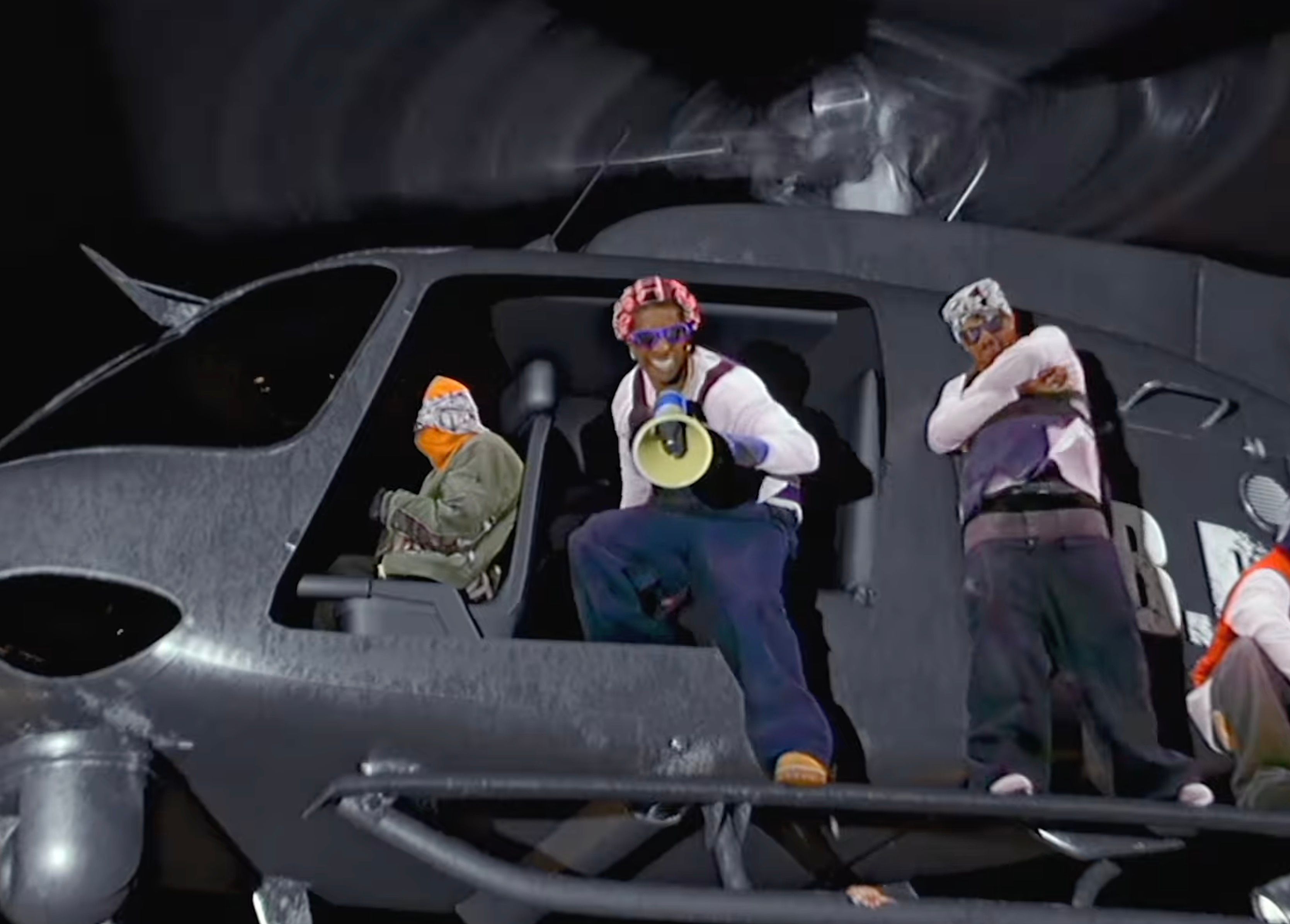 Watch A$AP Rocky fly through a dystopian riot in new “Helicopter$” video