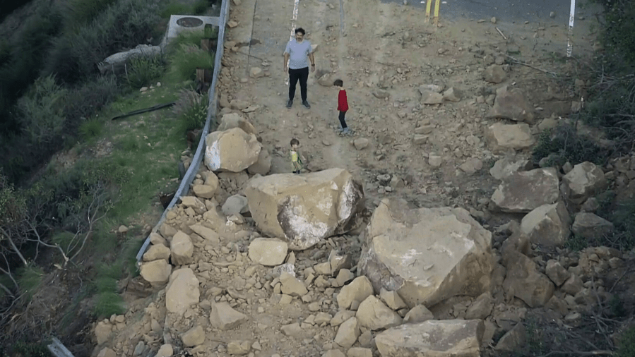 Children seen playing on rockslide debris that closed Southern ...