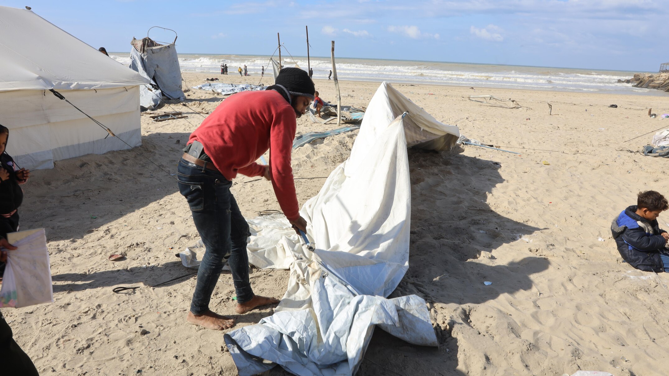 Gazans beg for shelter as winter storms batter millions and Israel ...