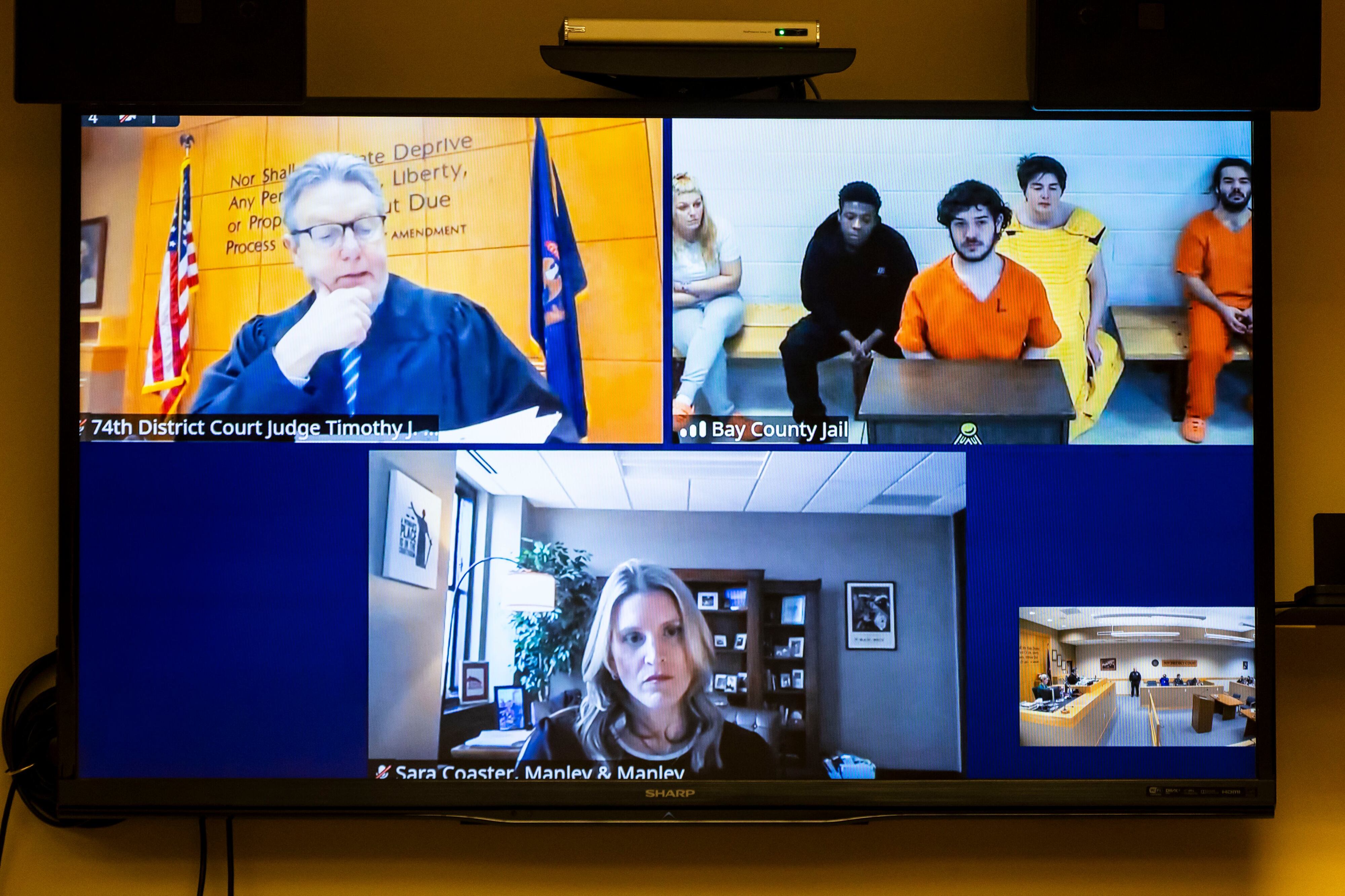 Bay City brothers charged in father’s East Side shooting death