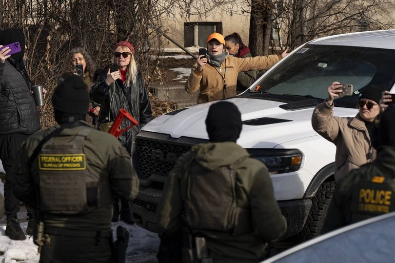 ICE agent warns Minneapolis driver in tense video after fatal Minnesota ...