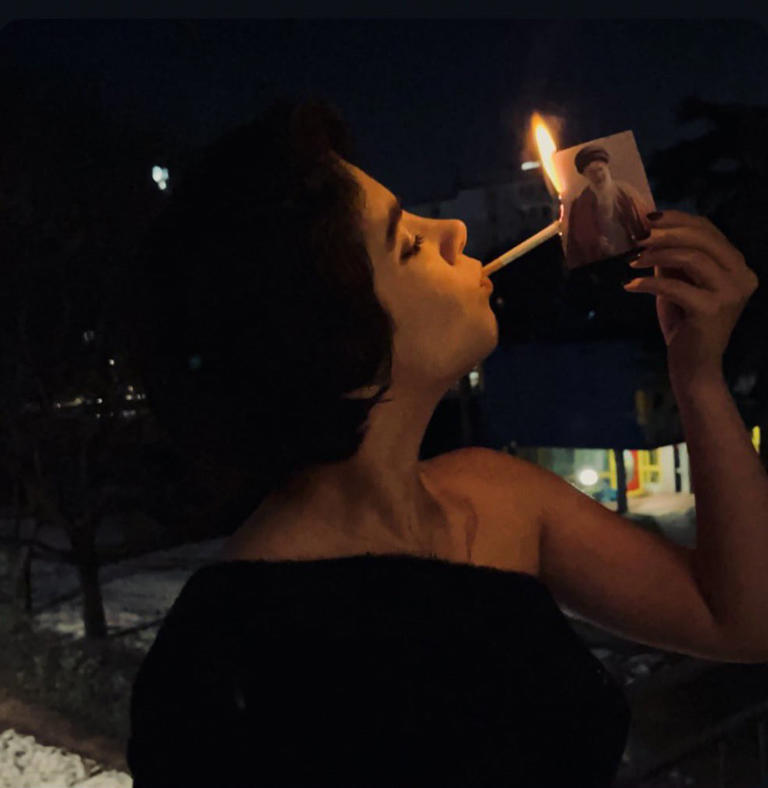 Woman Burning Hamei Photo Becomes Iran Protest Symbol