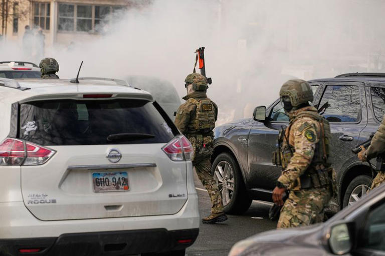 Federal agents fire tear gas at Minneapolis crowd chanting 'shame' as ...