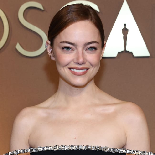 Emma Stone wears a butter-yellow set to the 2026 Golden Globes
