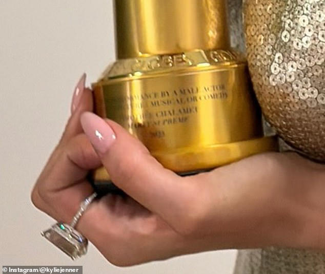 Kylie Jenner holds boyfriend Timothee Chalamet's Golden Globe trophy