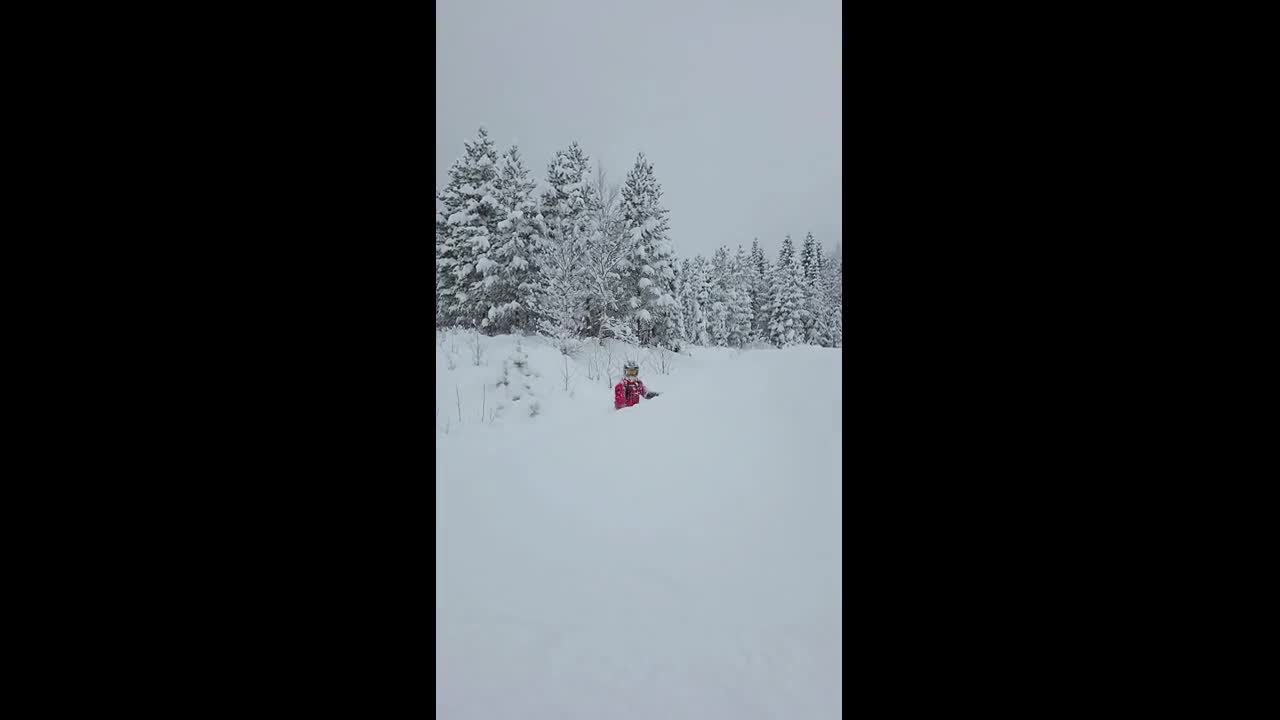 Snowmobiling struggle through towering snow in Bydalen, Sweden