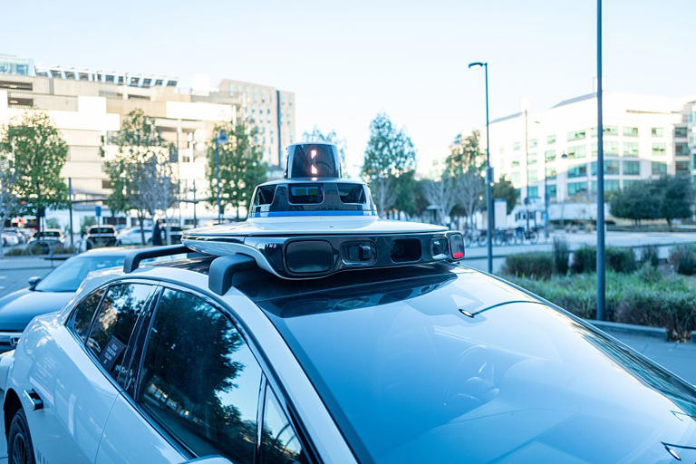 Waymo passenger jumps out after self-driving car drives onto train ...