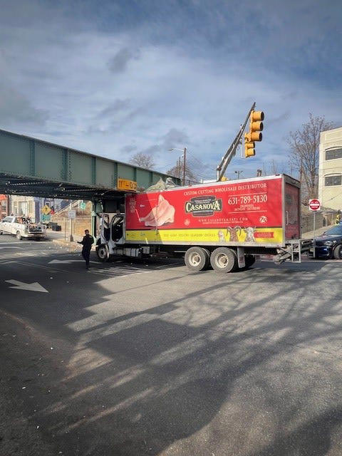 Truck gets stuck under Bergen train trestle. It's not the first time