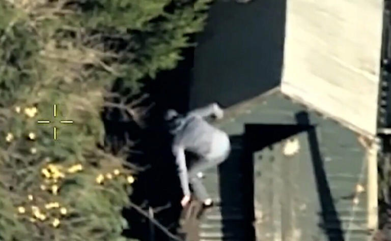Wanted man’s bid to escape police fails after he got stuck on shed roof
