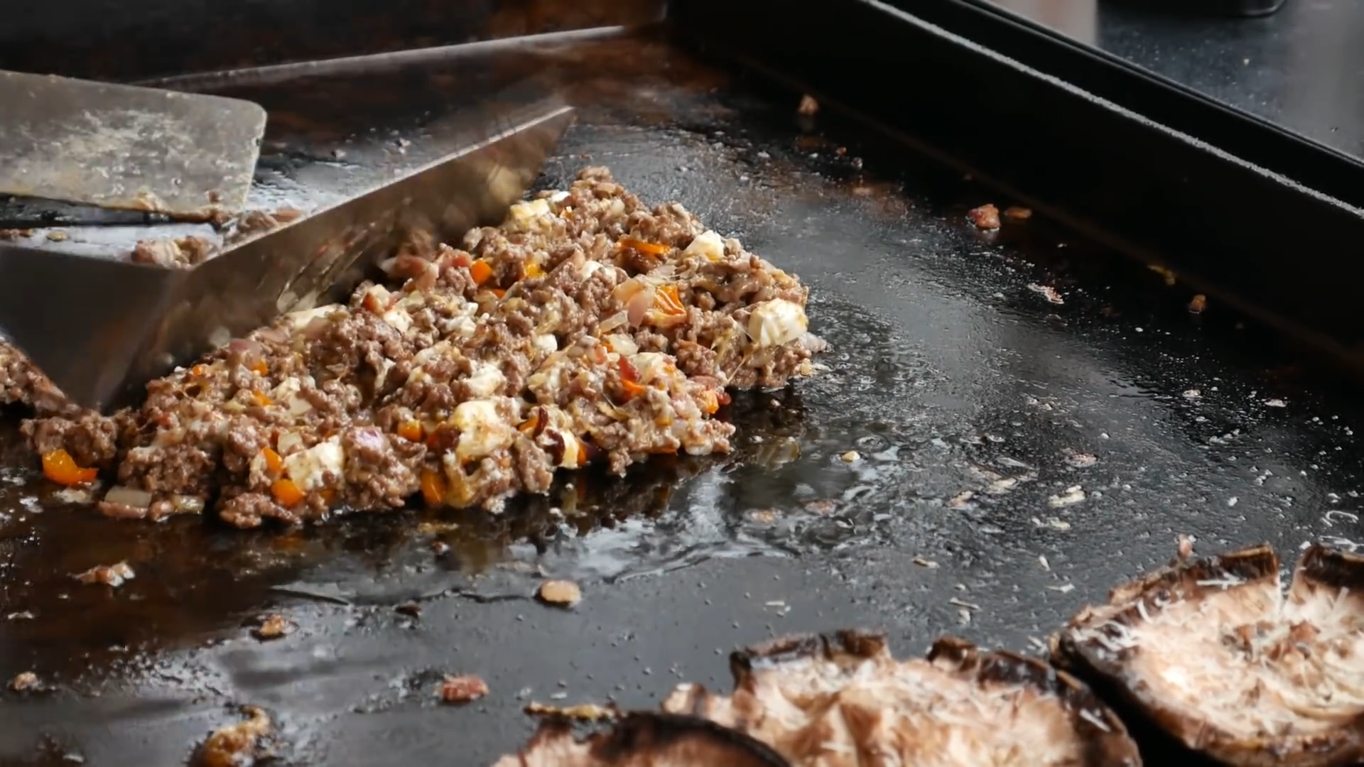 Bacon, burger, and cheese stuffed mushrooms on the Blackstone griddle
