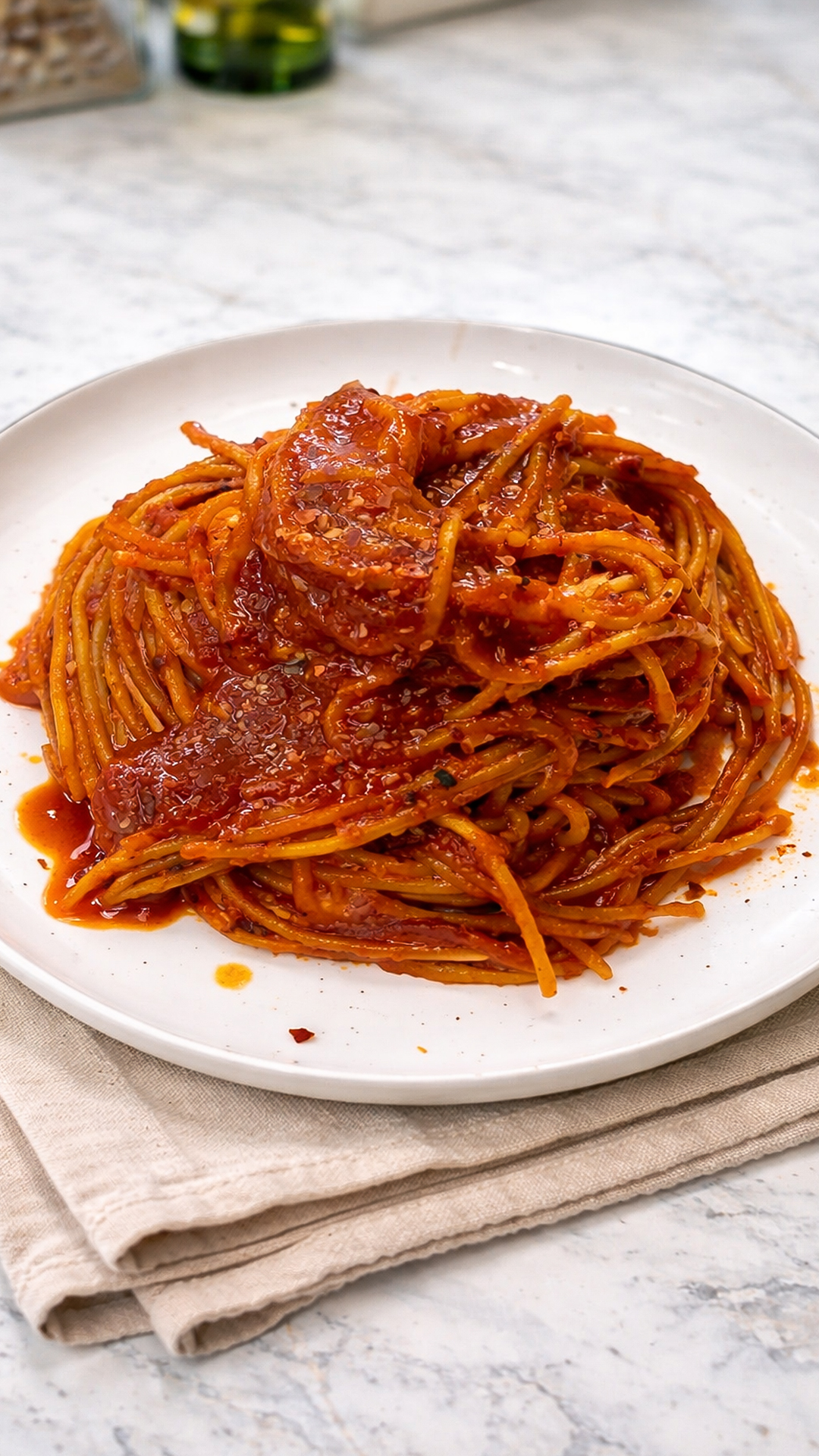 Cooking charred vegan pasta with garlic and chili