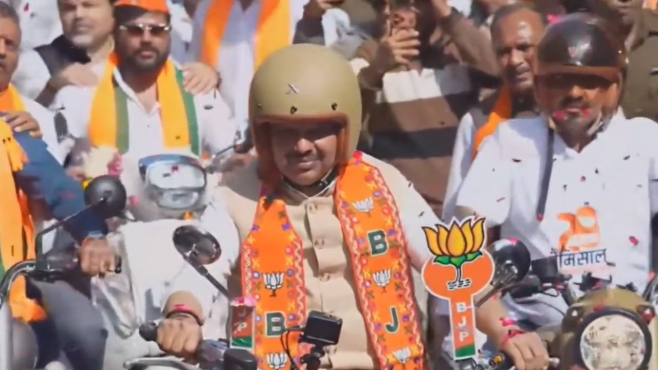 Maharashtra civic polls: Devendra Fadnavis rides Royal Enfield during ...