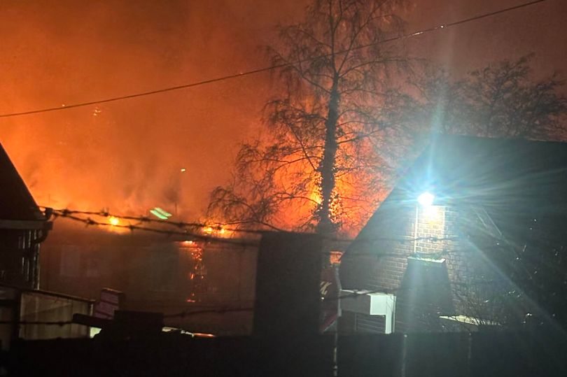 Fire rips through building near care home as locals 'wake up to bangs'