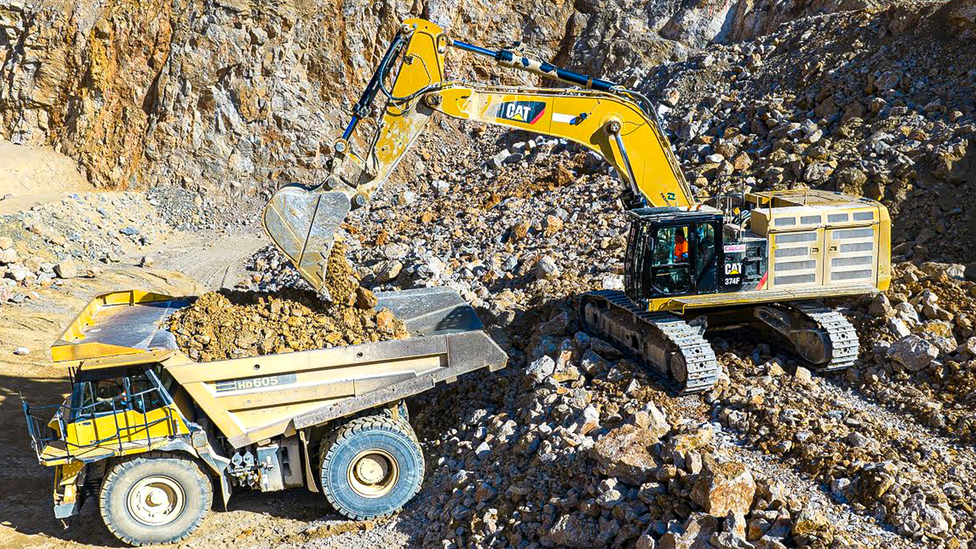 Powerful CAT excavator at work moving heavy loads