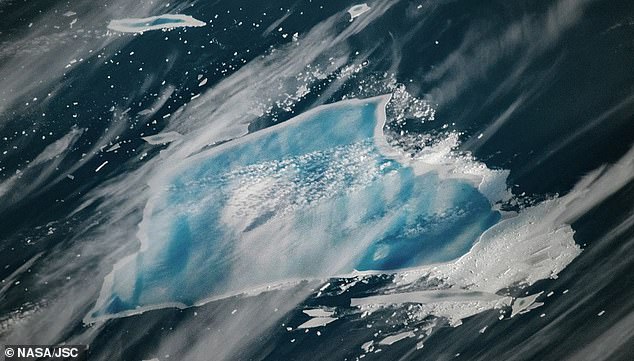 World's biggest iceberg turns blue as it rapidly heads towards complete ...