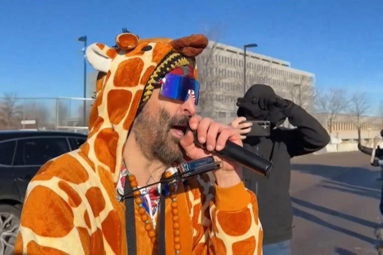 ICE arrest protester in giraffe costume at tense demonstration