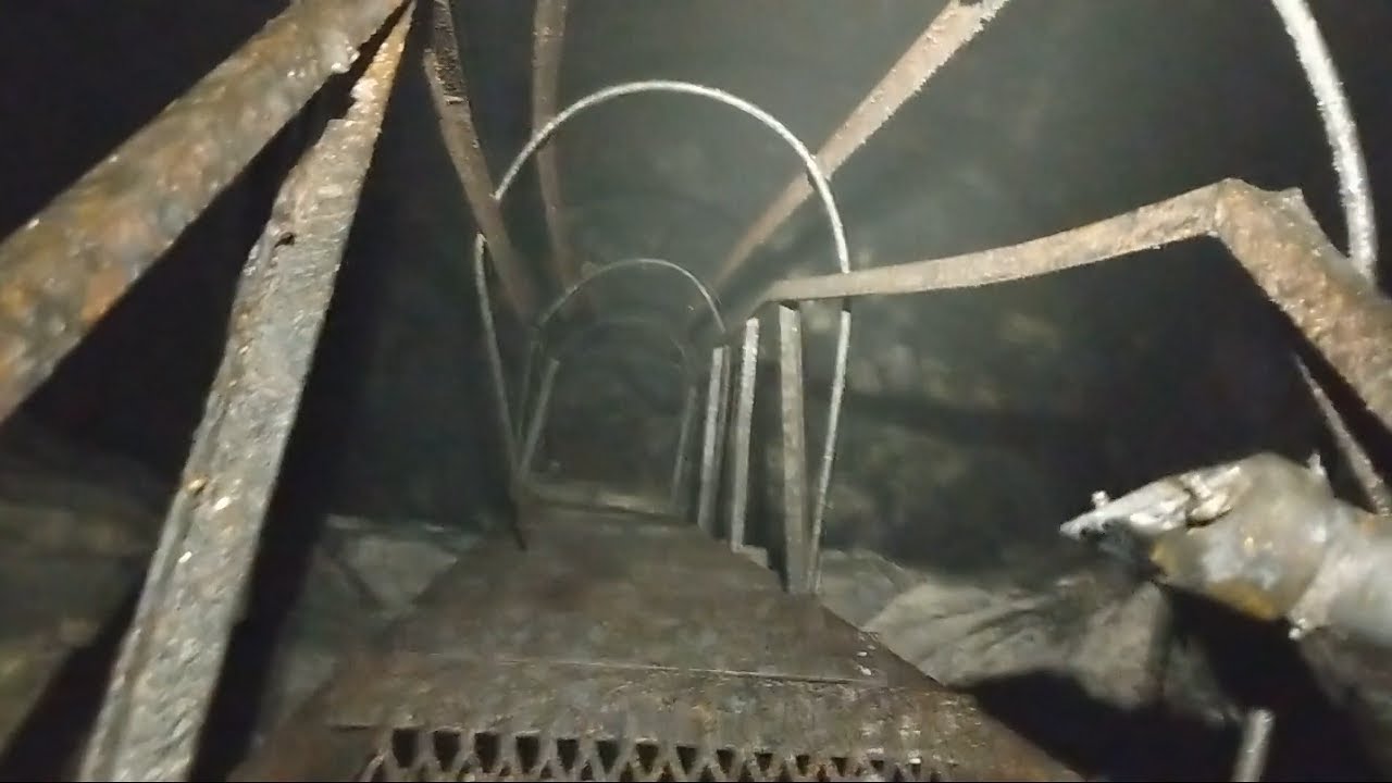 Inside a massive abandoned mine blackened by soot