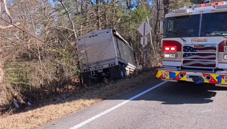Tractor-trailer driver dies after crashing into creek in North Carolina