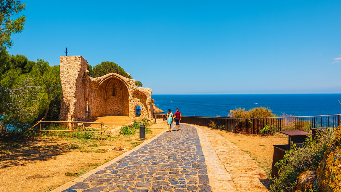 Walking through Tossa de Mar old town by the sea
